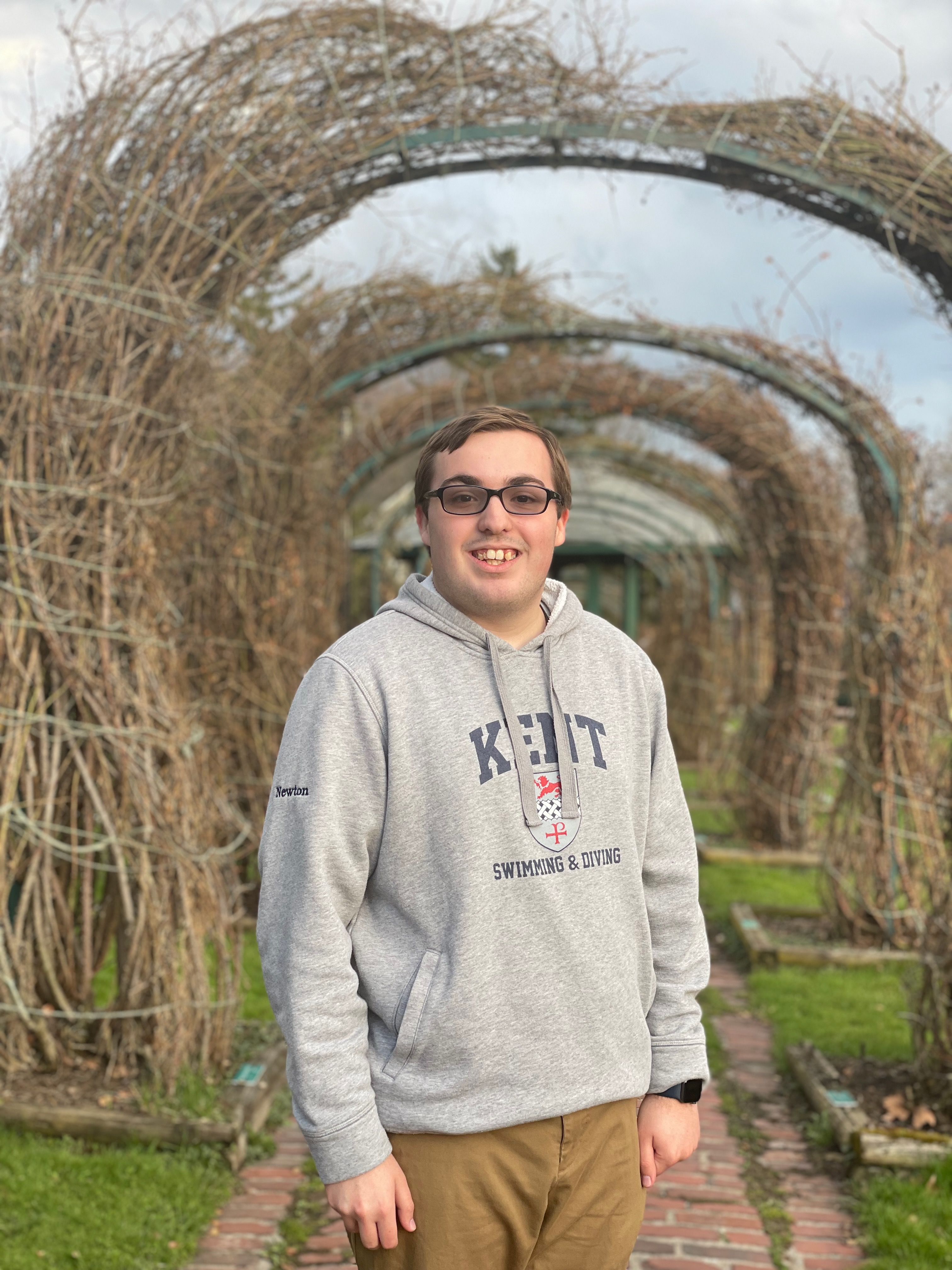 Image of Eli standing in the Thornden Park Rose Garden in Syracuse New York